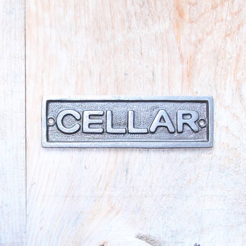 Cast iron cellar sign